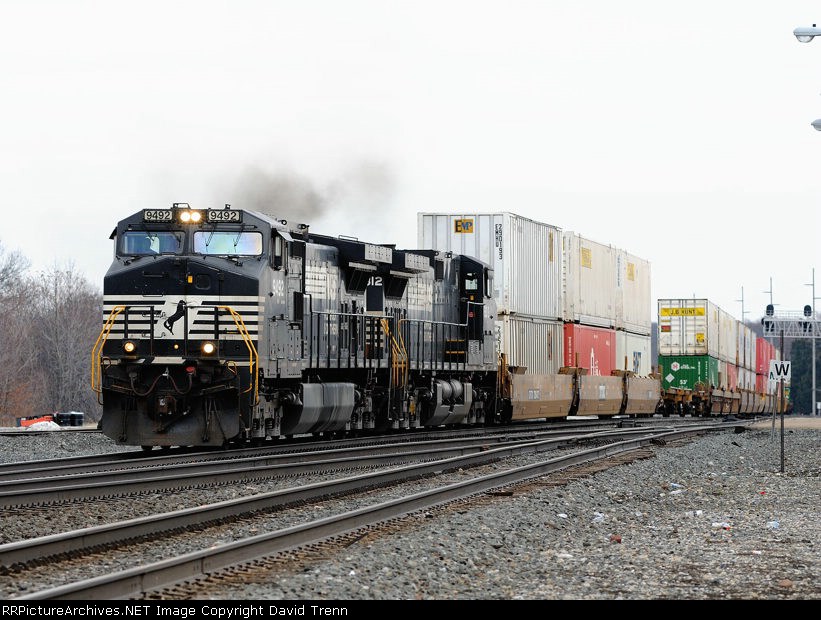 A Westbound NS stack train is lead by NS 9492